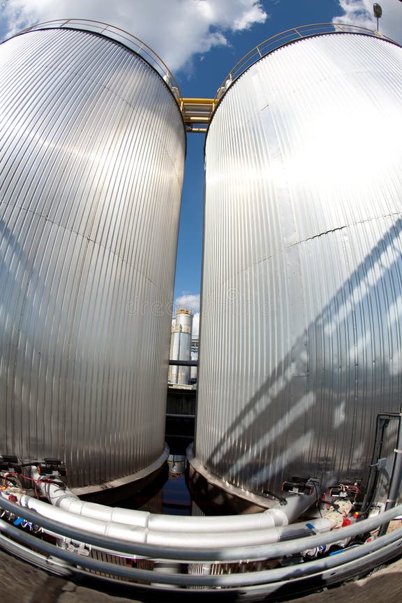 Silver tanks and pipelines stock photo. Image of structure - 18016070