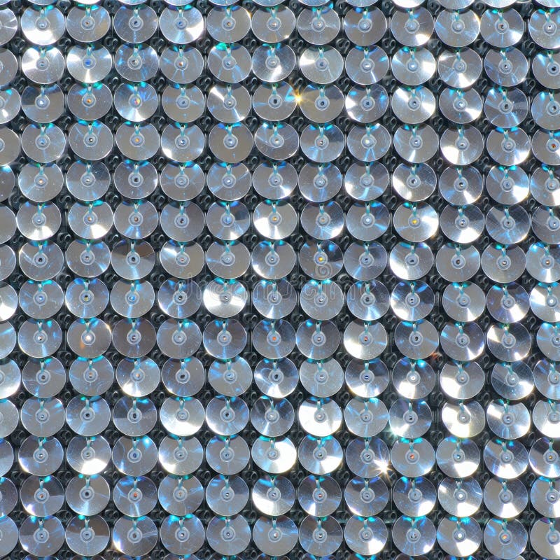 Silver-to-blue Gradient Discs Shimmer in a Grid Pattern on Black Fabric ...