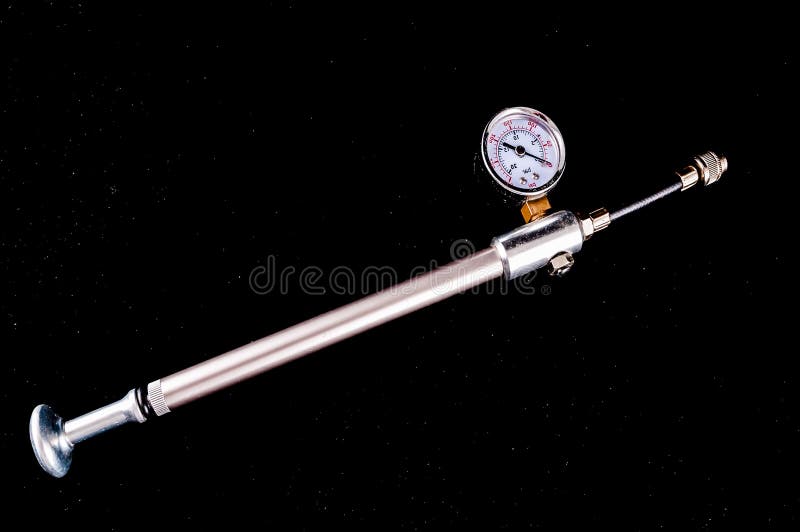 A Silver Tool with a Black Handle and a Red and White Gauge Stock Photo ...