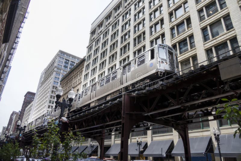 Silver Train Speeding on a Track through a City Editorial Image - Image ...