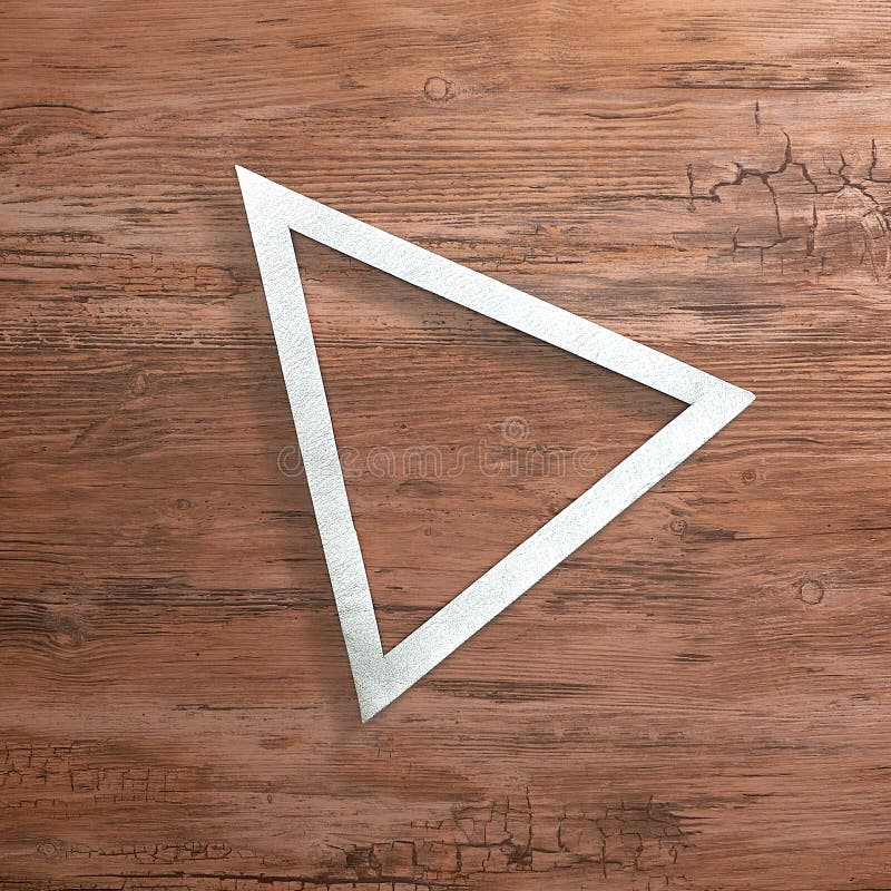 Silver Triangular Frame on a Wooden Background. Text Space. Top View ...