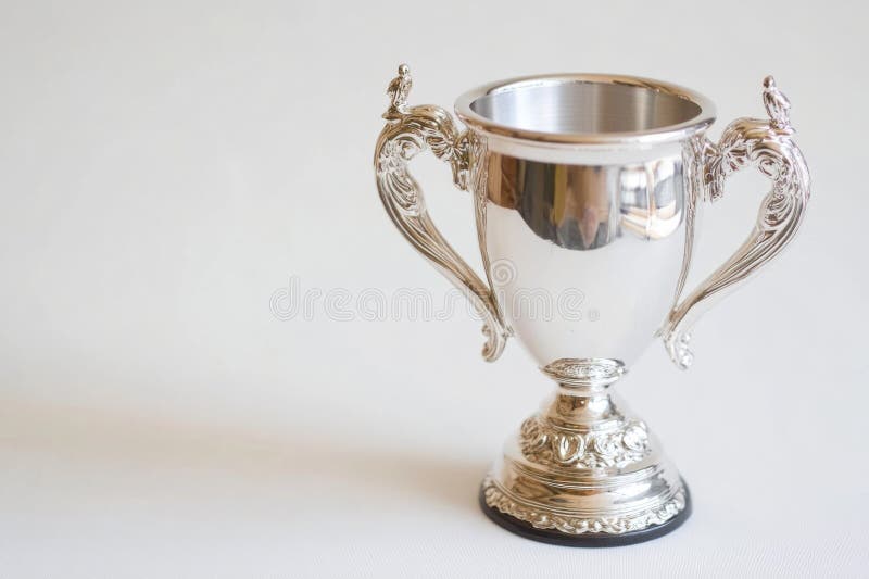A Silver Trophy Sitting on a Table, Perfect for Awards or Recognition ...