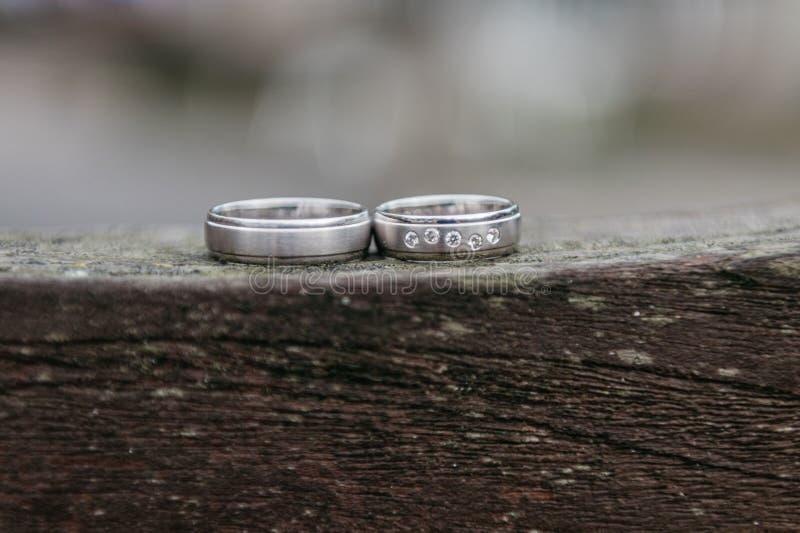 Silver Wedding Bands on Rustic Wood Stock Photo - Image of elegant ...