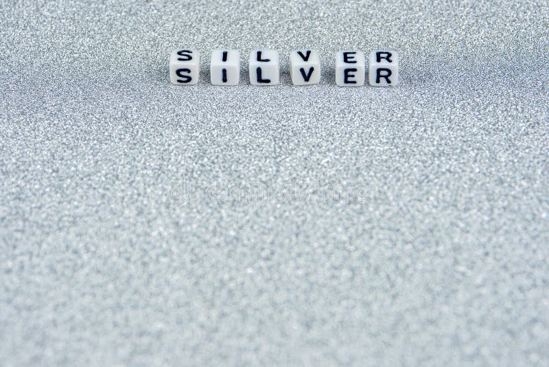Silver Word Formed by White Dices with Black Letters Laying on Silver ...