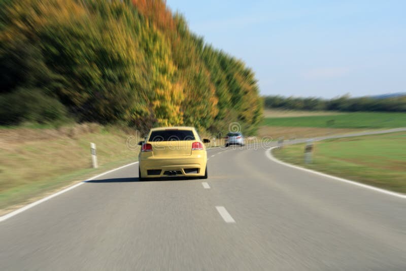 Silver and Yellow Car Driving on the Road Stock Photo - Image of cloud ...
