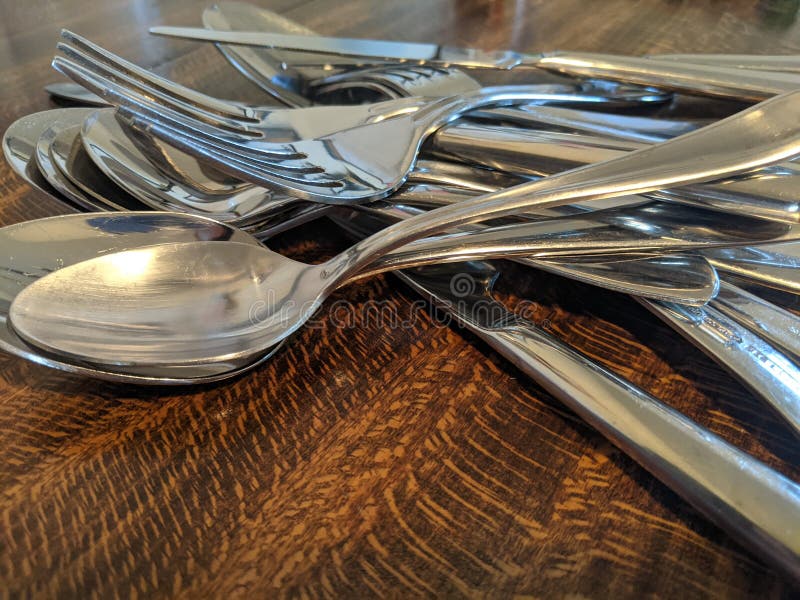 Silverware on wood table stock photo. Image of fork - 203817454