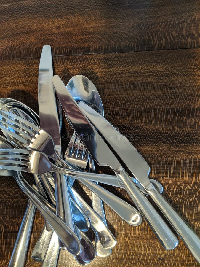Silverware on wood table stock photo. Image of cutlery - 203817476