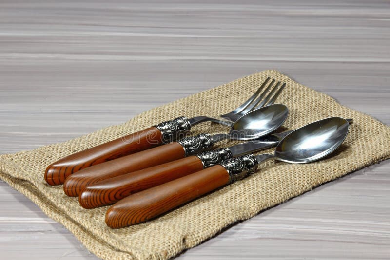 Silverware with Wooden Handle Stock Image - Image of napkin, meal: 87872517