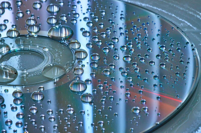 Silvery Blue Surface and Background with Water Drops on CD in Abstract ...