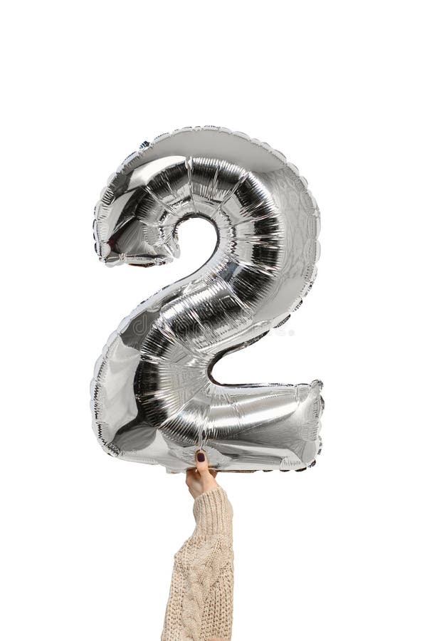 Silvery Inflatable Figure Zero in a Female Hand. Close-up Stock Photo ...