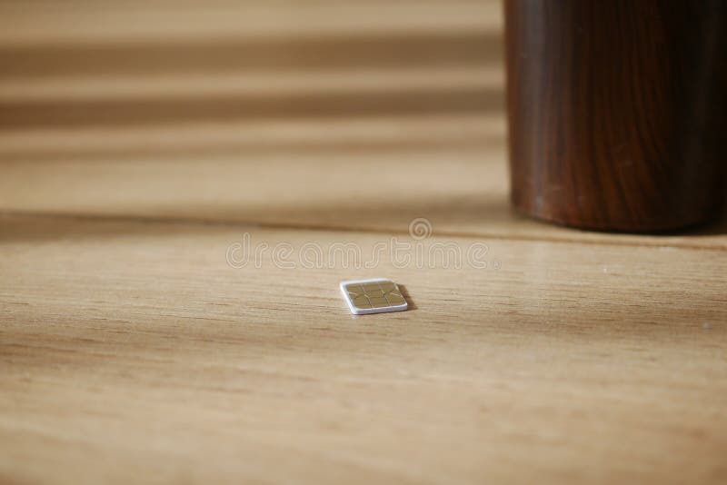 Sim Card Lost on a Wooden Floor Stock Image - Image of informal ...