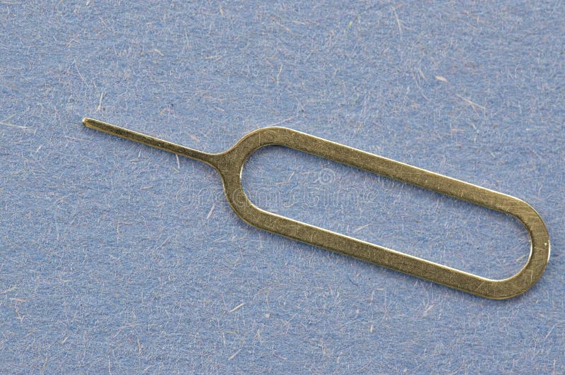 SIM Card Removal Tool on a Blue Background Stock Photo - Image of tool ...