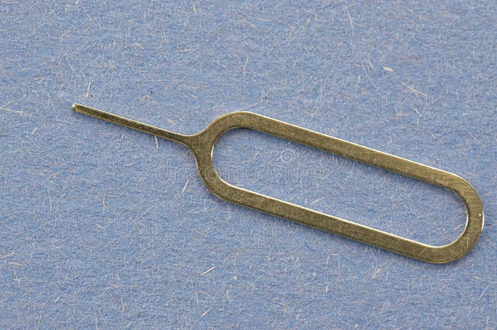 SIM Card Removal Tool on a Blue Background Stock Photo - Image of tool ...