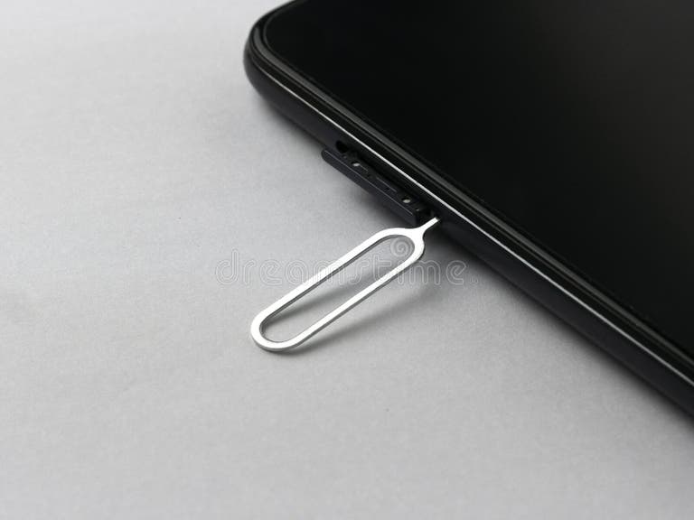 Sim Card Tray Remover Eject Pin Key Tool and Smartphone Stock Image ...