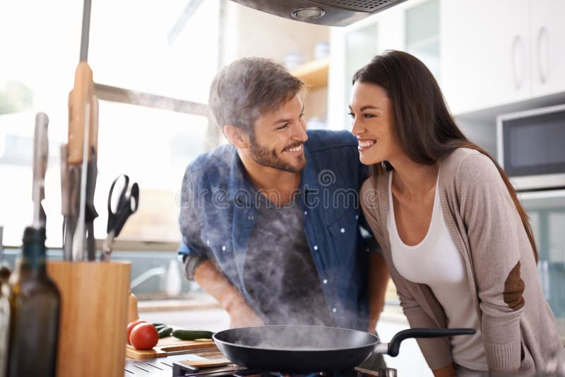 Simmer Down You Two. a Young Couple Making Dinner Together at Home ...