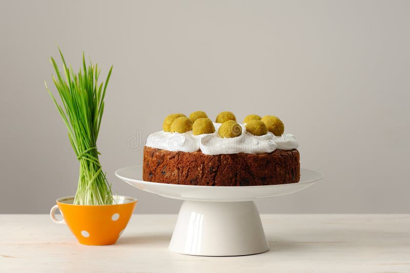 Simnel, English Easter Cake in White Stand and Bright Green Grass on ...