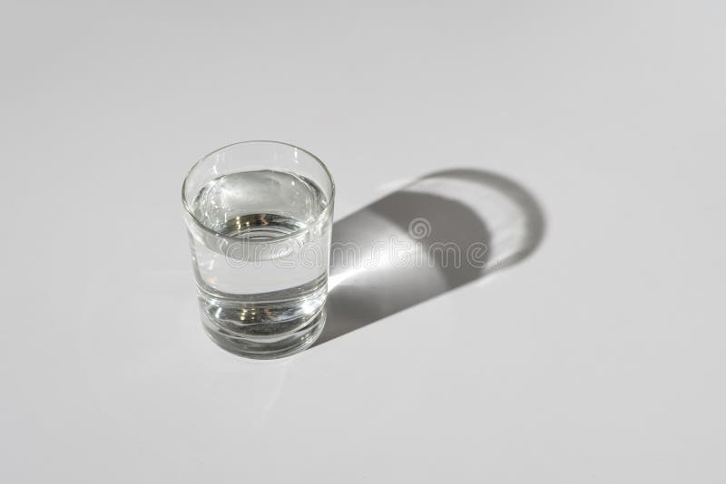 Simple Abstract Still Water with a Harsh Shadow on the Table Stock ...