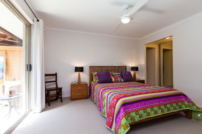 Simple bedroom stock photo. Image of furniture, comfortable - 77910822