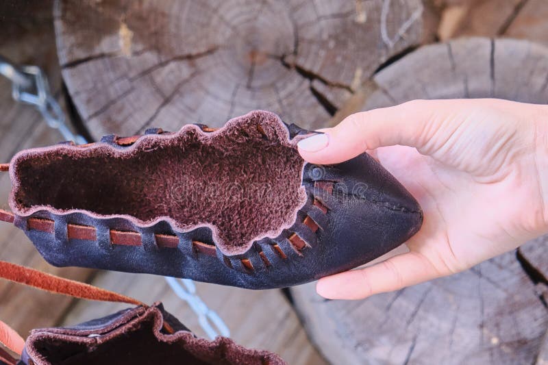 A Simple Black Boot Made of Rough Leather. Shoes in Hand Made of ...