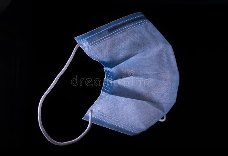 Simple Blue Standard Surgical Mask Isolated on Black Stock Photo ...