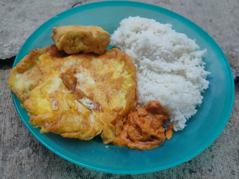 A Simple Breakfast Menu, Rice with Egg Tofu and Chili Sauce Served on a ...