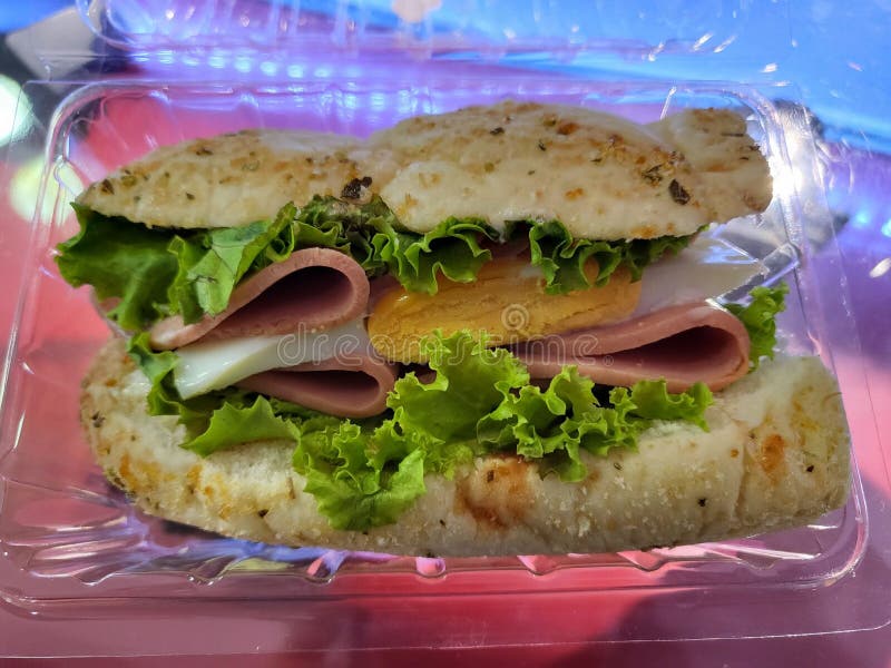 A Simple Breakfast Sandwich of Eggs, Ham and Vegetables in a Clear ...