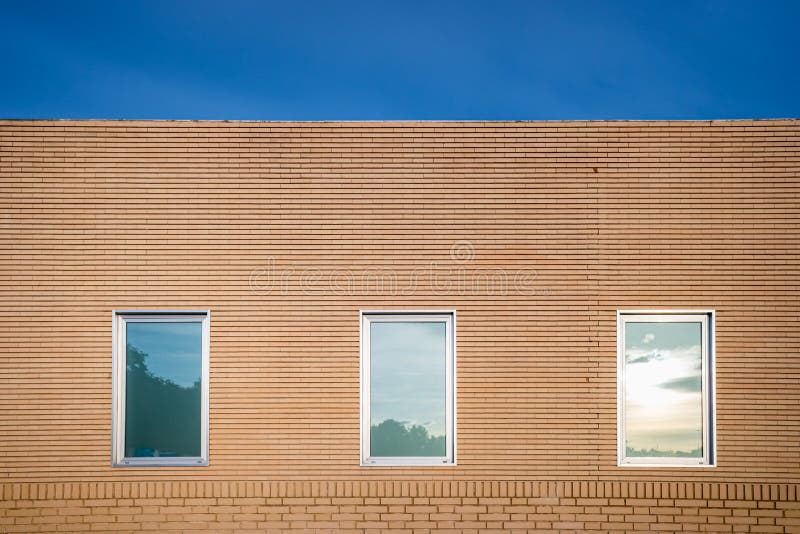 Simple Brick Facade with Two Vertical Windows Stock Photo - Image of ...