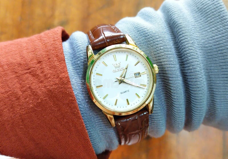 Simple Brown Watch on the Hand Editorial Image - Image of blue, strap ...
