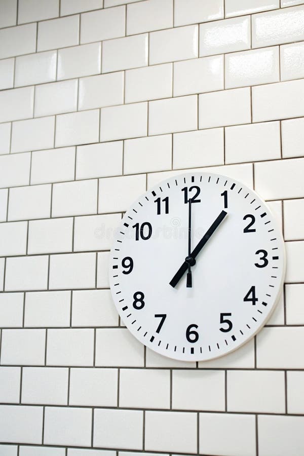 Simple Clock or Watch on White Tile Wall Displaying One O Clock Stock ...