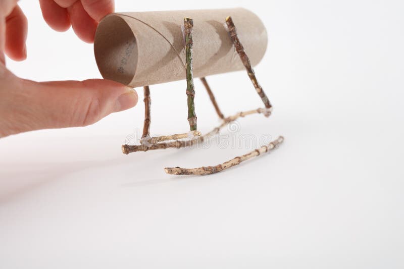 A Simple Craft Project Made from a Cardboard Tube and Small Sticks ...