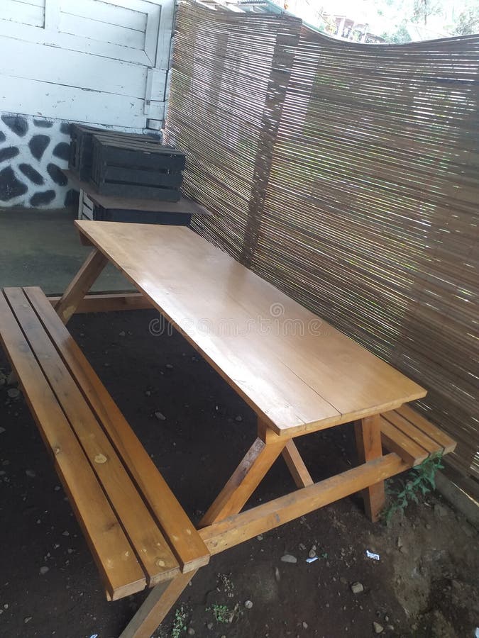 Simple Dining Table Complete with Benches Attached Stock Image - Image ...