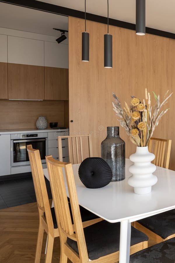 Simple Dining Table Next To Kitchen Stock Photo - Image of flat, chair ...