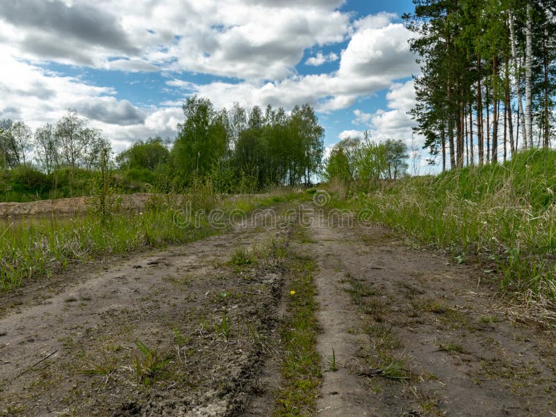 A Simple Dirt Road, Clay New and Old Grass, Spring Landscape Stock ...
