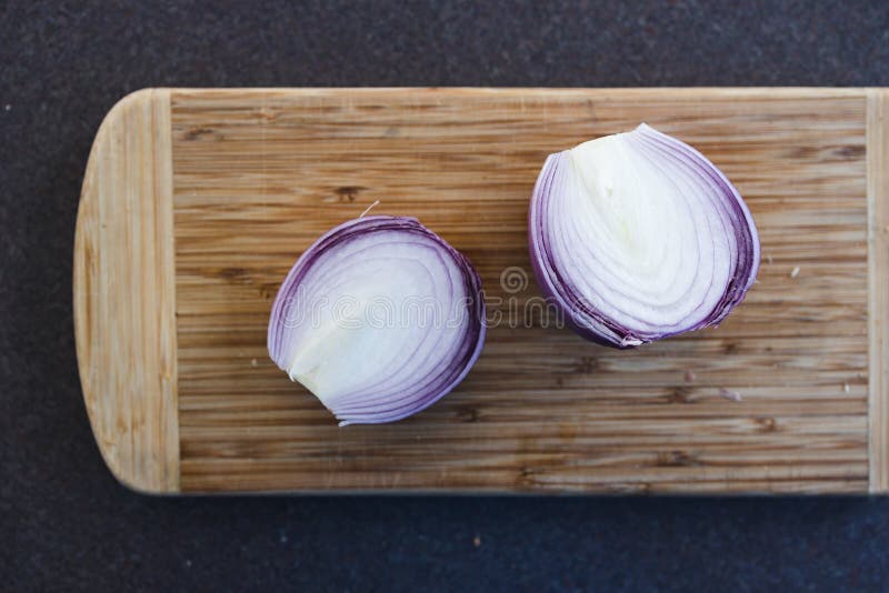 Simple Food Ingredients, Red Onion Cut in Half on Bamboo Chopping Board ... Simple Food Ingredients, Red Onion Cut in Half on Bamboo Chopping Board ...