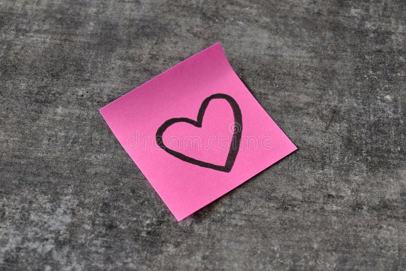Simple Heart Drawn on a Pink Sticky Note on a Gray Surface Stock Photo ...