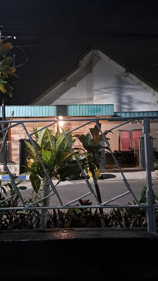 A Simple House at Night with an Old-fashioned House Model. Stock Photo ...