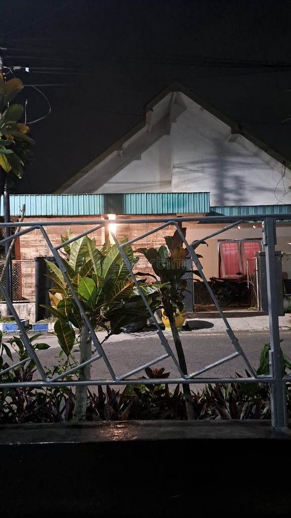 A Simple House at Night with an Old-fashioned House Model. Stock Photo ...