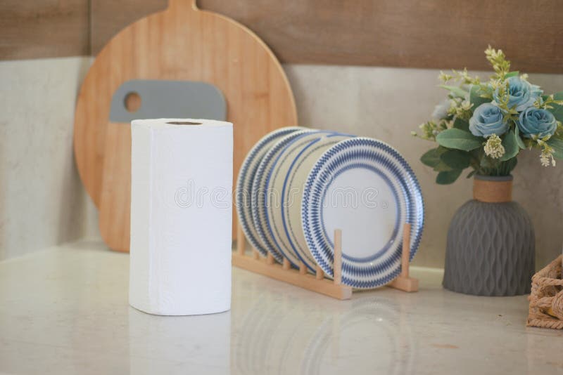 Simple Kitchen Countertop with White Roll, Dish Rack, and Floral ...