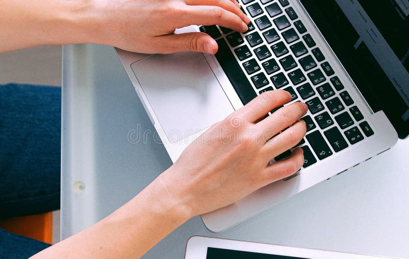 Simple Laptop while typing stock image. Image of person - 250542547