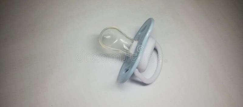 A Simple Light Blue Baby Pacifier on a White Background Stock Image ...