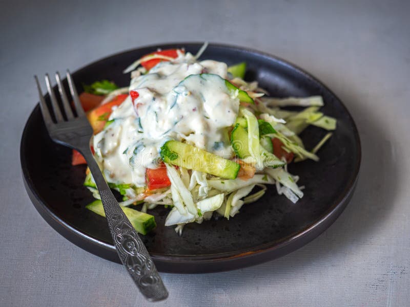 Simple Light Breakfast Coleslaw with Vegetables on a Dark Plate on a ...