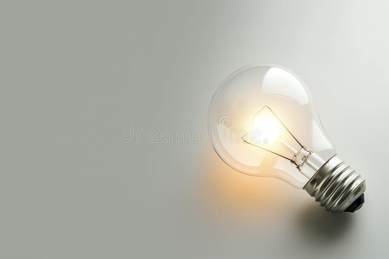 A Simple Light Bulb is Glow on White Table Stock Illustration ...