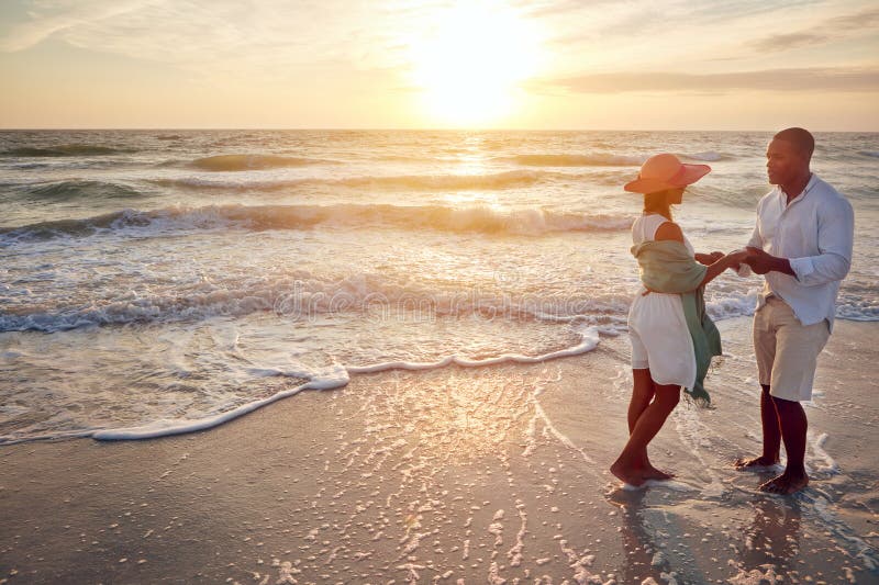 The Simple Memories are the Most Precious. a Romantic Couple Dancing on the Beach at Sunset ...