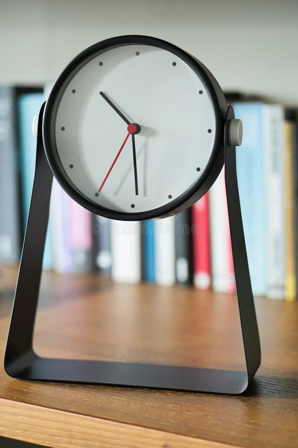 Simple Modern Clock on a Book Shelf . Stock Image - Image of watch ...