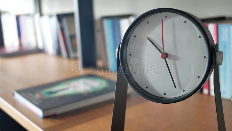 Simple Modern Clock on a Book Shelf . Stock Footage - Video of break ...