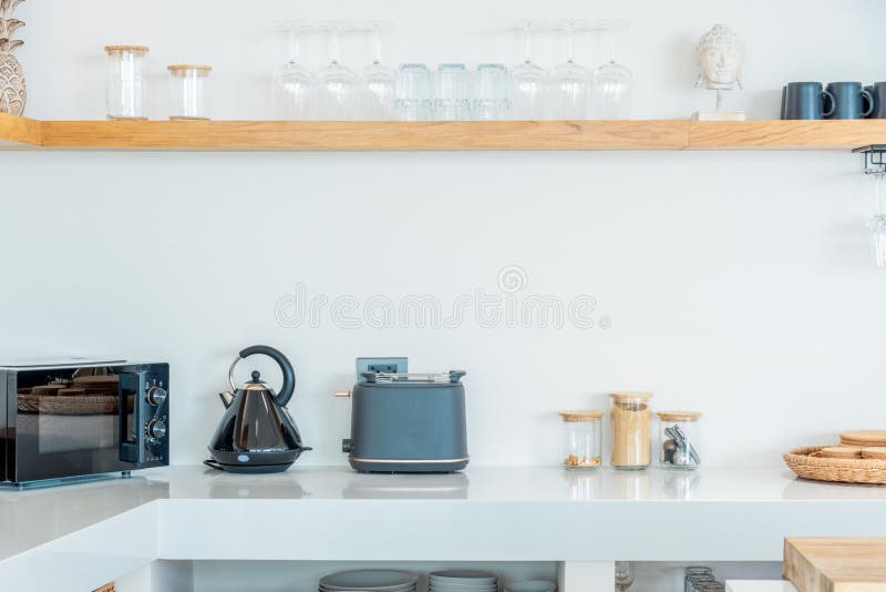 Simple Modern Kitchen with White Counter and Wooden Top and Kitchenware ...