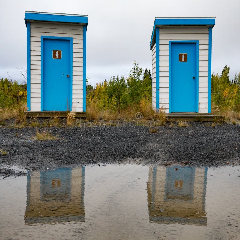 Simple Outhouses Mirrored in Puddle Stock Image - Image of cloudy ...