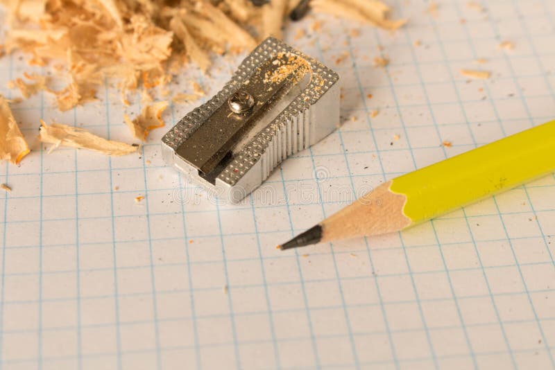 A Simple Pencil and Sharpener on a Clean Sheet of Paper. Close Up Stock ...