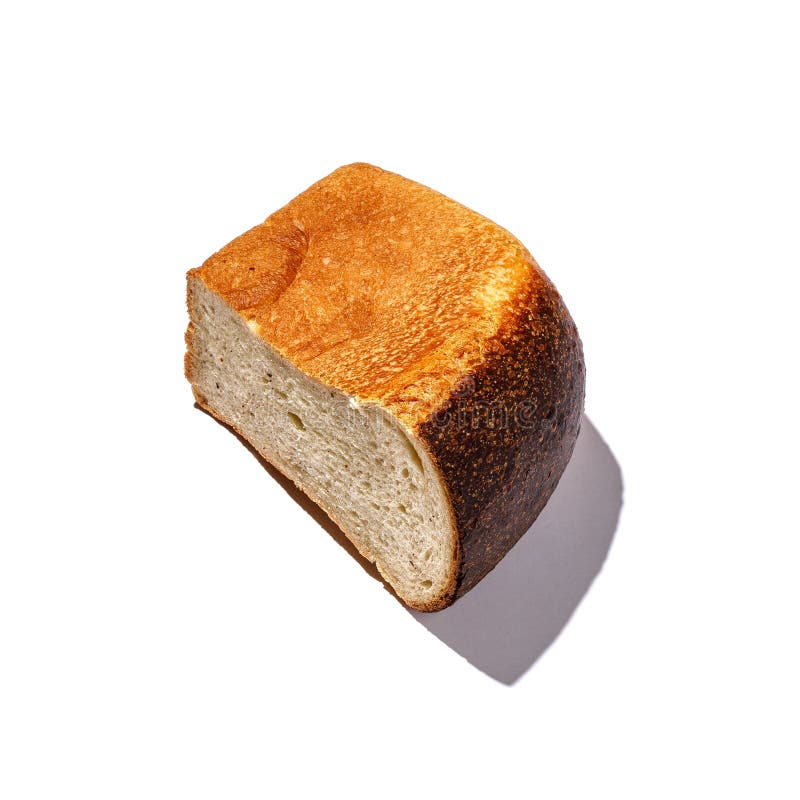 A Piece of Bread Casting a Shadow on a White Background Stock Photo ...