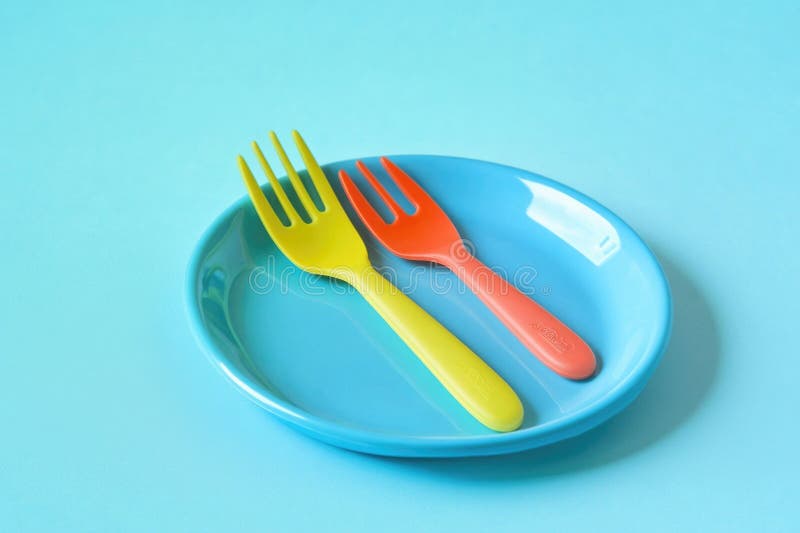 A Simple Plate with Two Plastic Forks, Ready for a Meal or Snack Stock ...